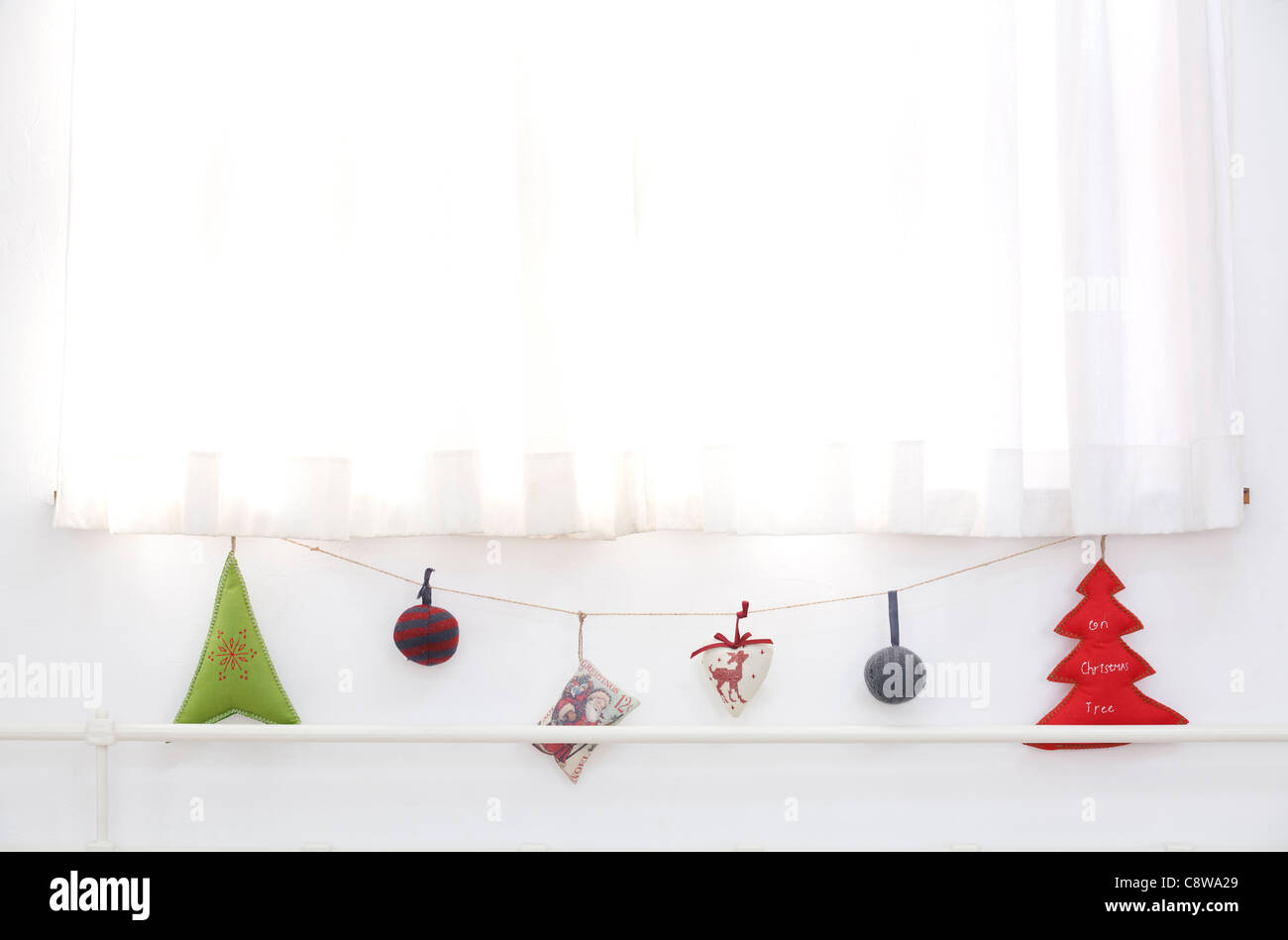 Hanging by string hi-res stock photography and images - Alamy