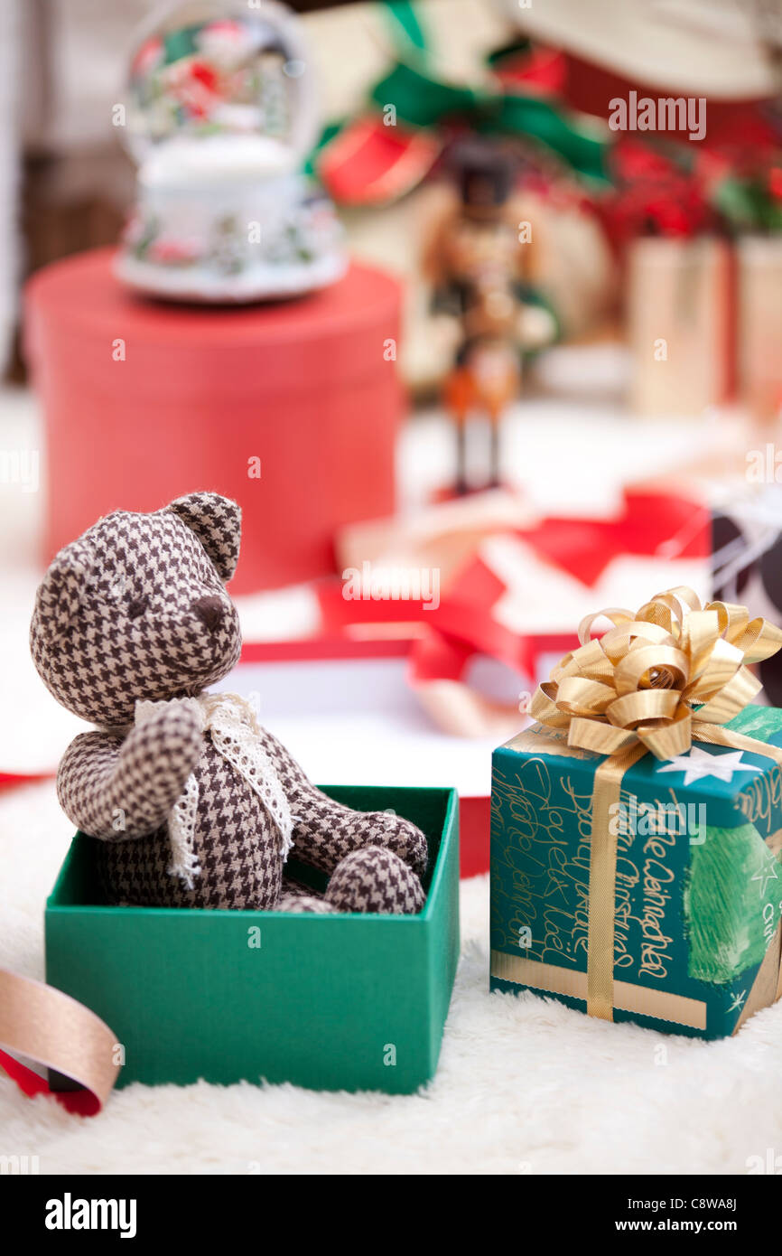 Teddy Bear, Christmas Snow Globe And Toys From Unwrapped Gift Boxes ...