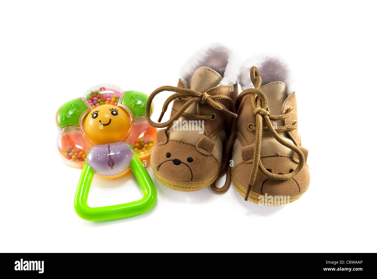 baby shoes and rattle isolated on a white background Stock Photo - Alamy