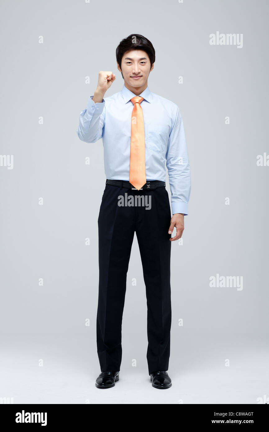 Portrait Of Businessman Clenching His Fist Stock Photo - Alamy