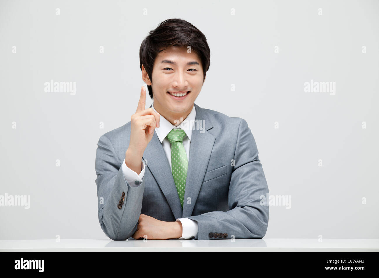 Portrait Of Businessman Pointing Finger Stock Photo - Alamy