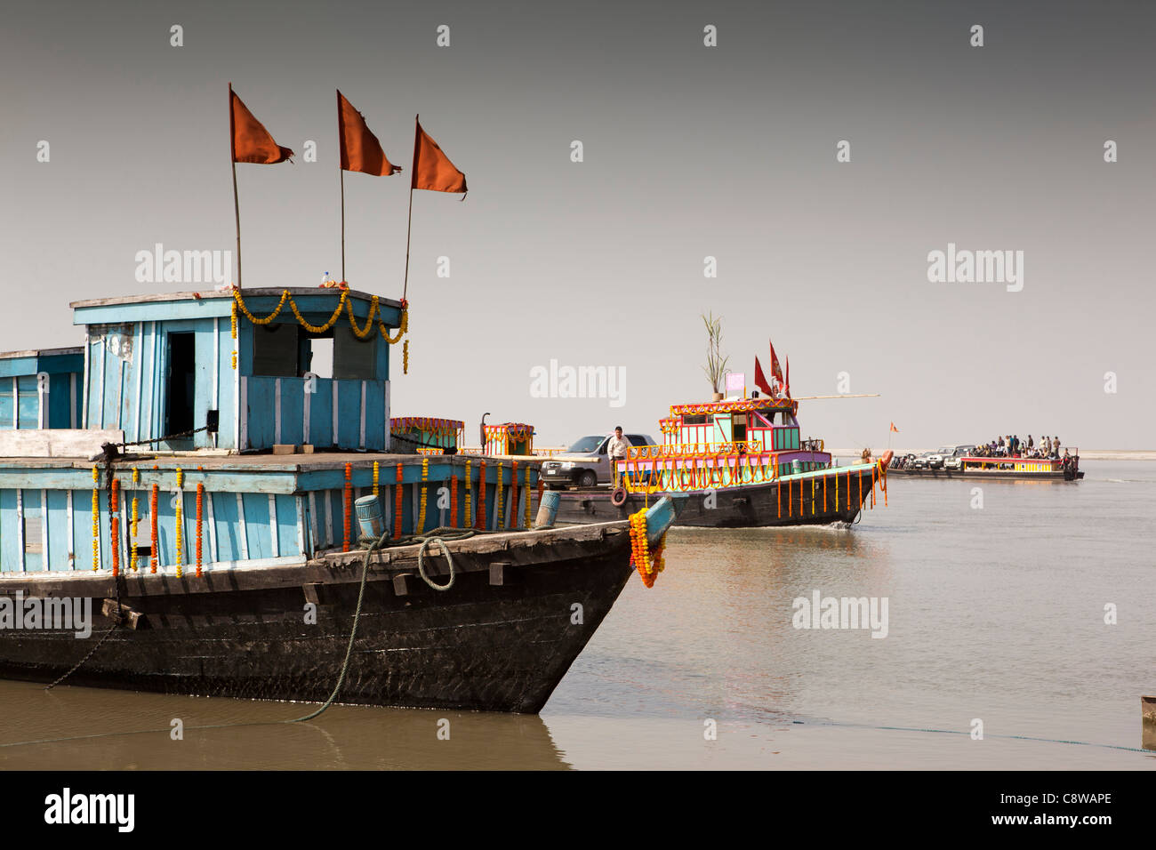 India, Assam, Dibrugarh, Brahmaputra River ferries waiting to load with ...