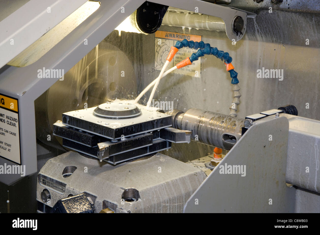 CNC lathe working on job detail Stock Photo - Alamy