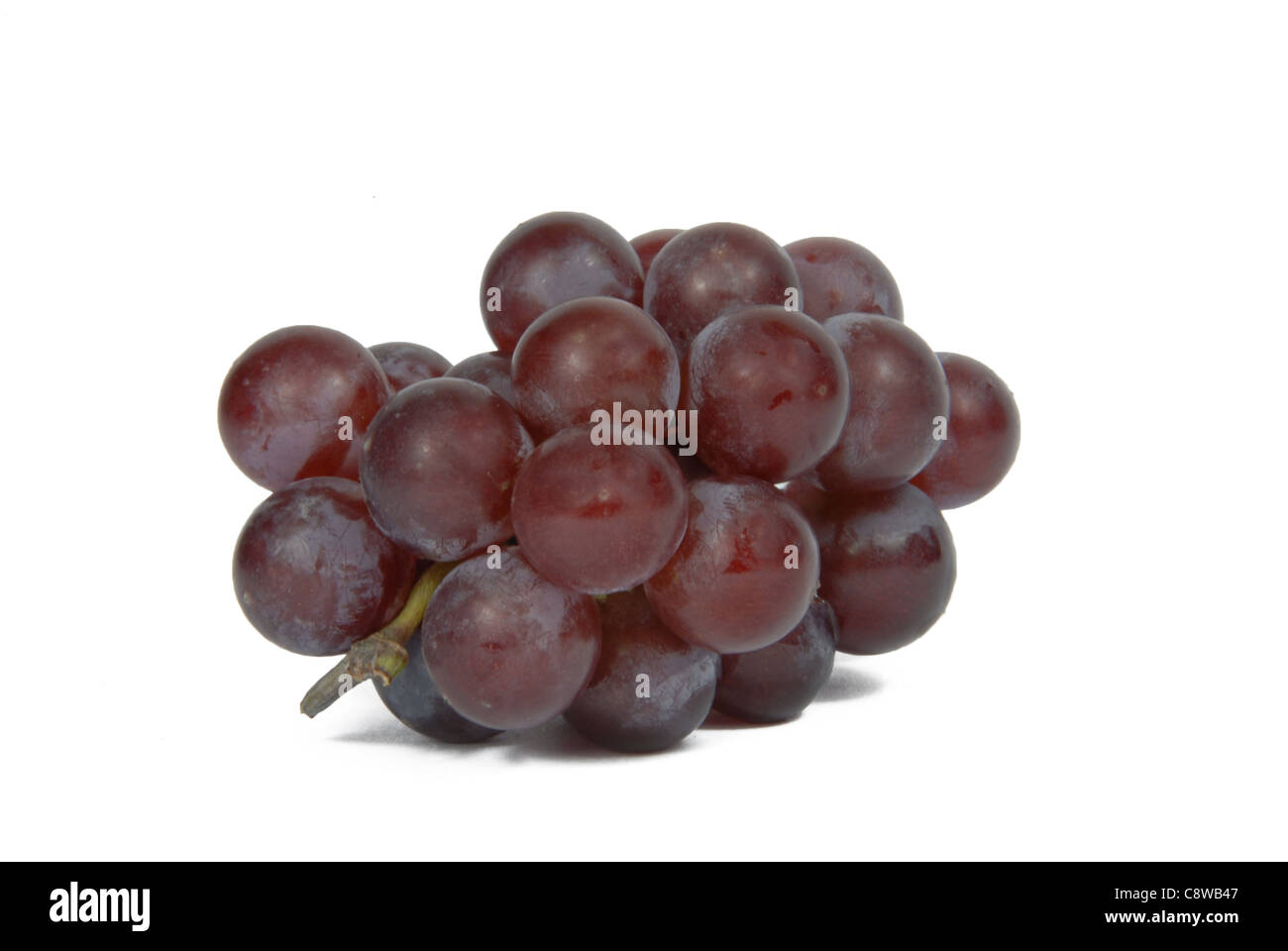 seeds red grapes in white background Stock Photo - Alamy