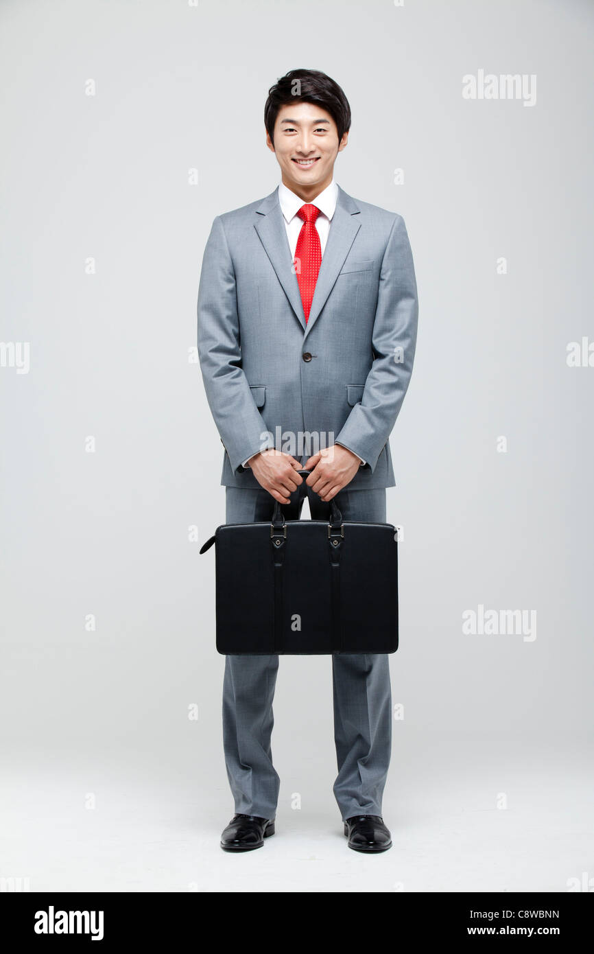 Man carrying a suitcase hi-res stock photography and images - Alamy
