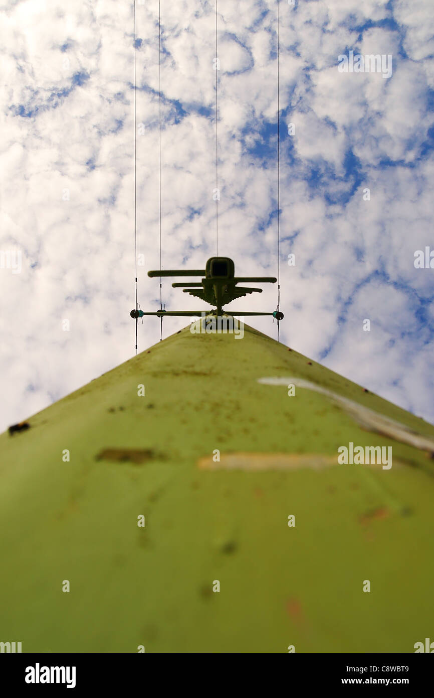 electrical post with climbing hooks going to the sky Stock Photo - Alamy
