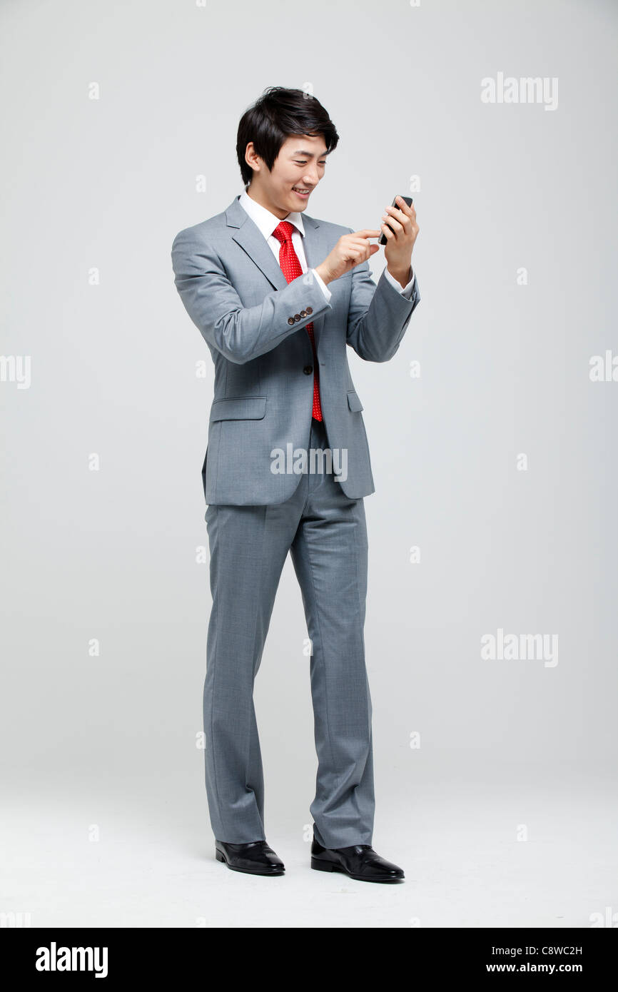 Positive man using cell hi-res stock photography and images - Alamy