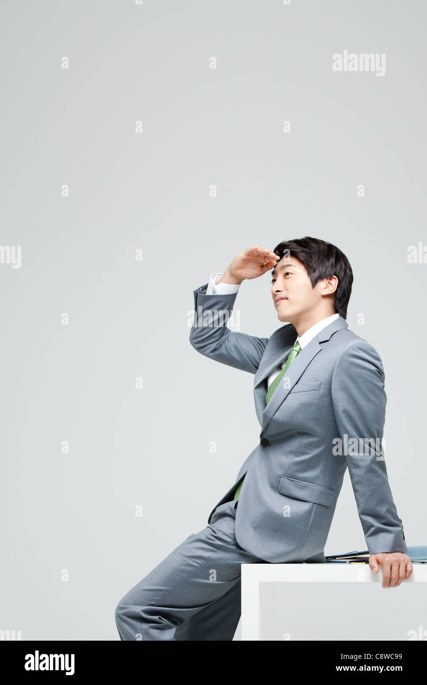 Korean smiling man with black hair looking away hi-res stock ...