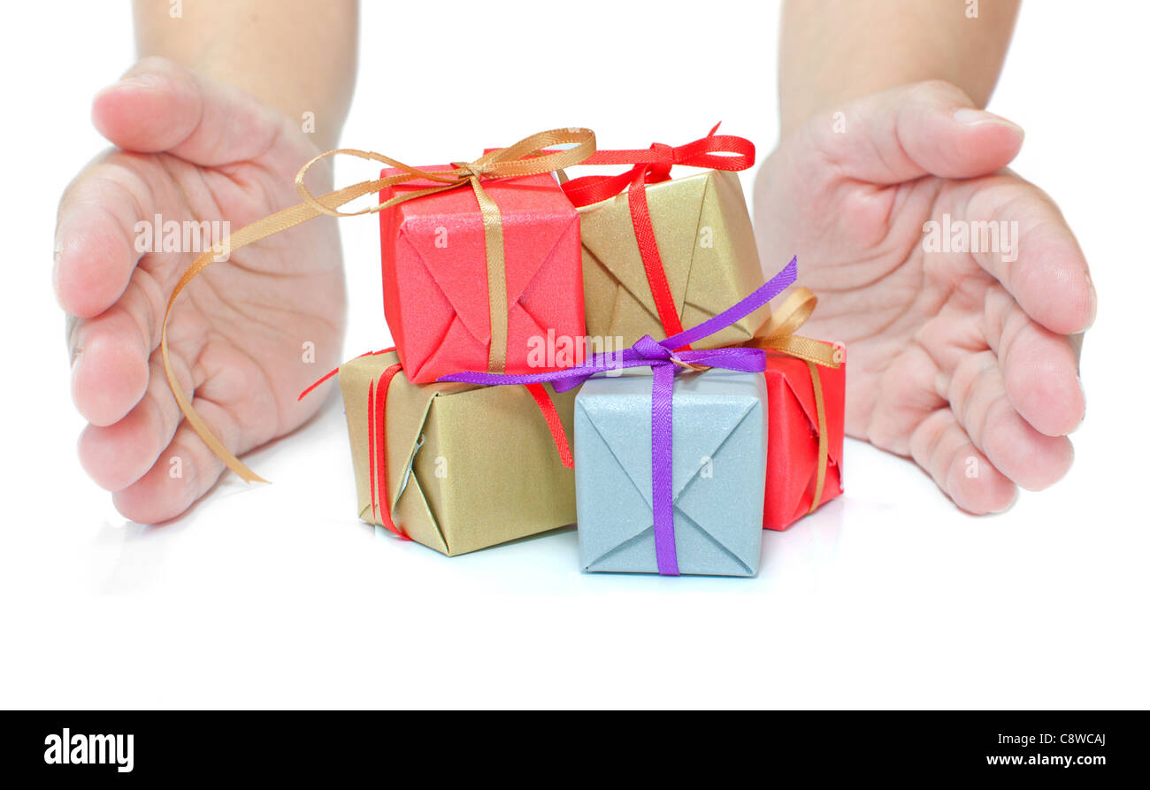Hands presenting severall small gift boxes Stock Photo - Alamy