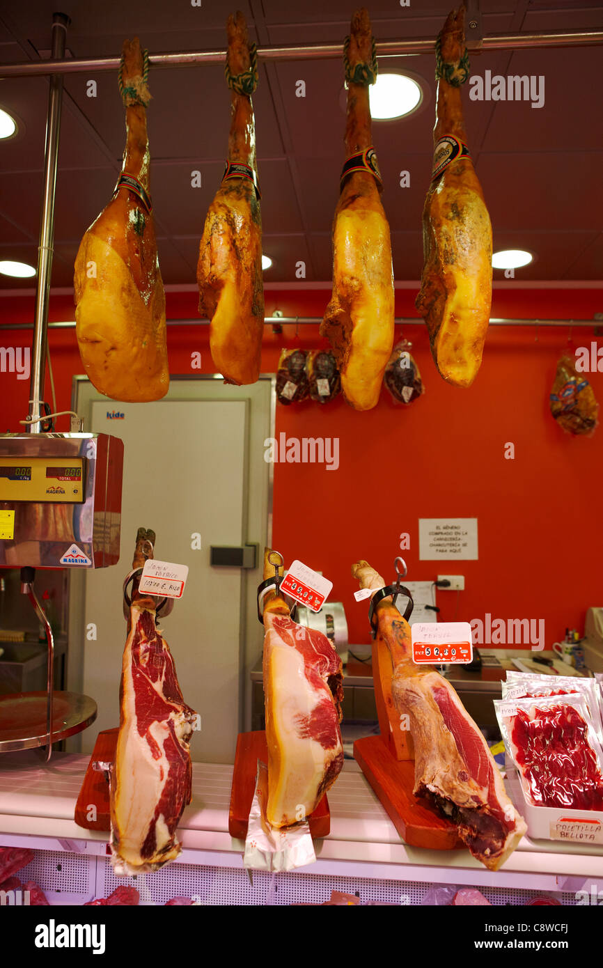 A selection of Jamon, Spanish dry-cured ham displayed for sale in a ...