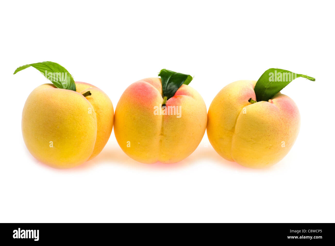 object on white - plastic peach close up Stock Photo - Alamy