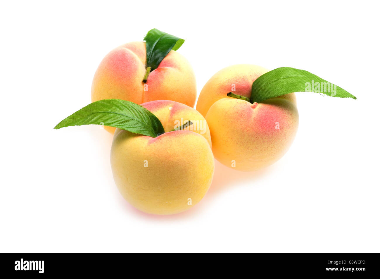 object on white - plastic peach close up Stock Photo - Alamy