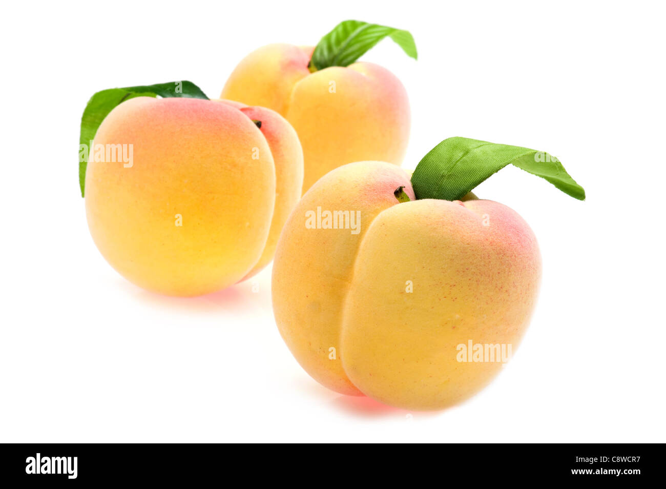 object on white - plastic peach close up Stock Photo - Alamy