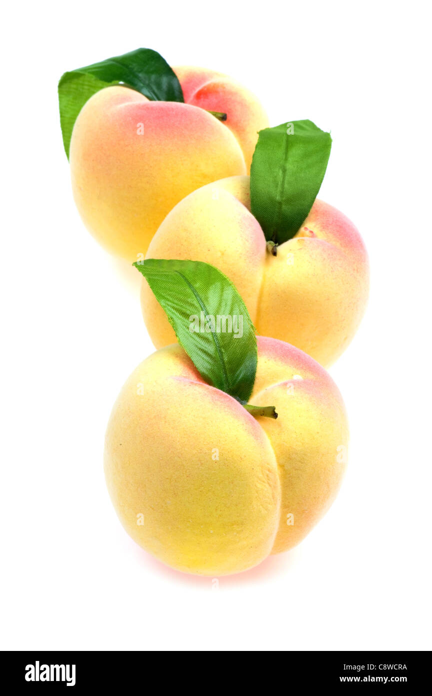 object on white - plastic peach close up Stock Photo - Alamy