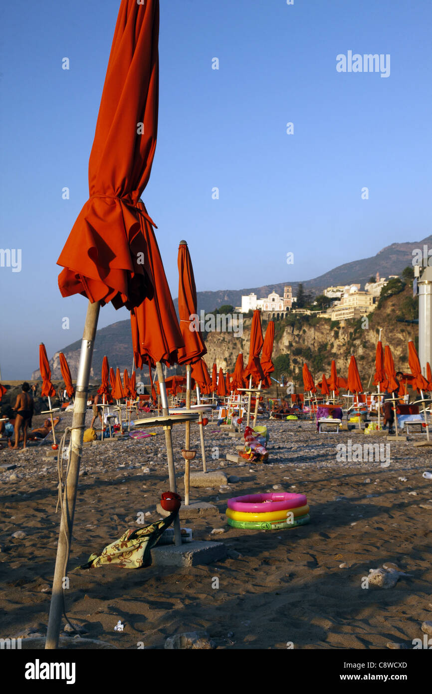 RED PARASOLS ON PEBBLE BEACH SEIANO ITALY 17 September 2011 Stock Photo ...