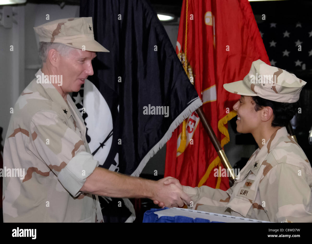 Rear Adm. Terence McKnight, left, congratulates Rear Adm. Michelle ...