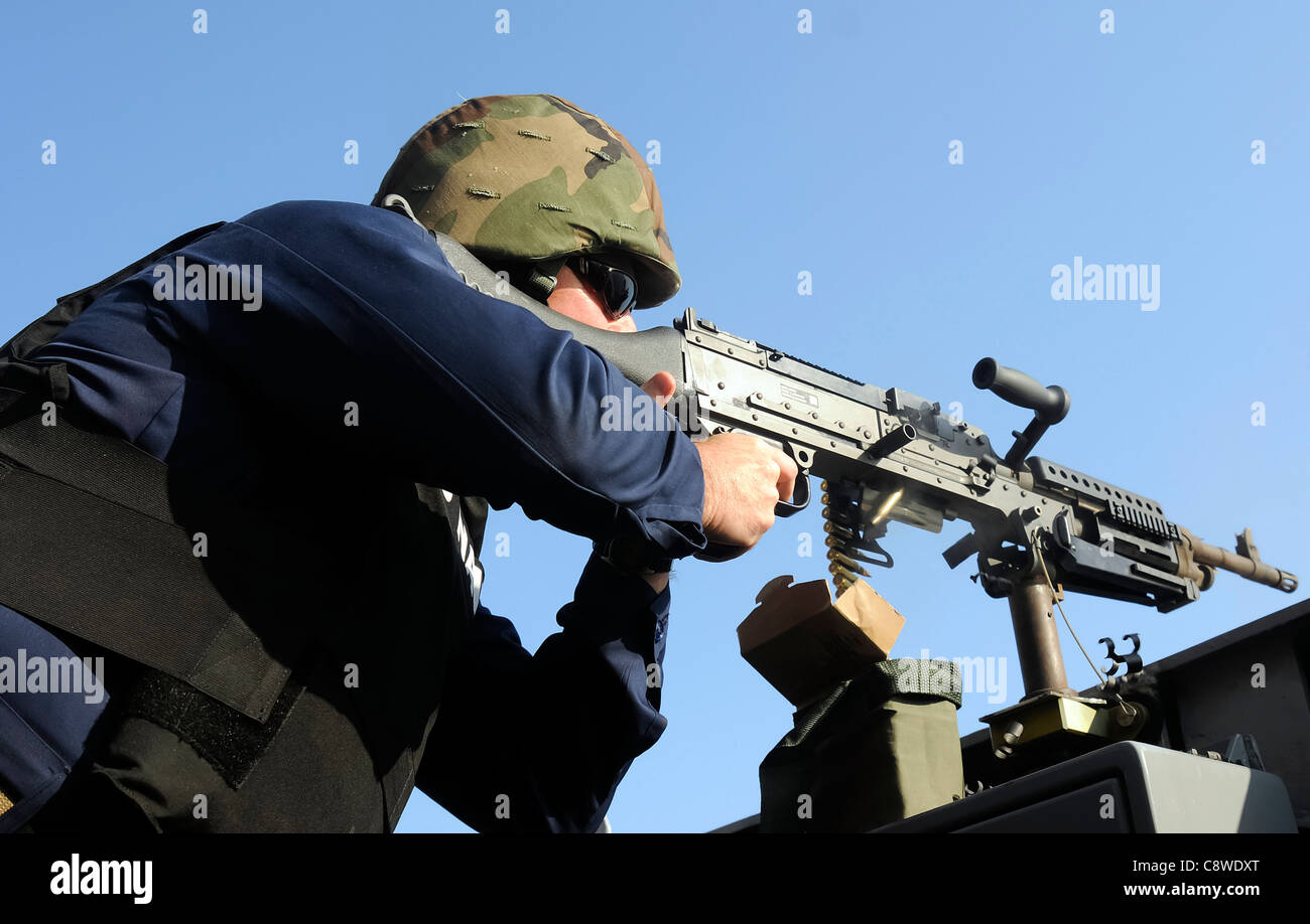 aboard the guided-missile cruiser USS Chosin (CG 65) conducts target ...
