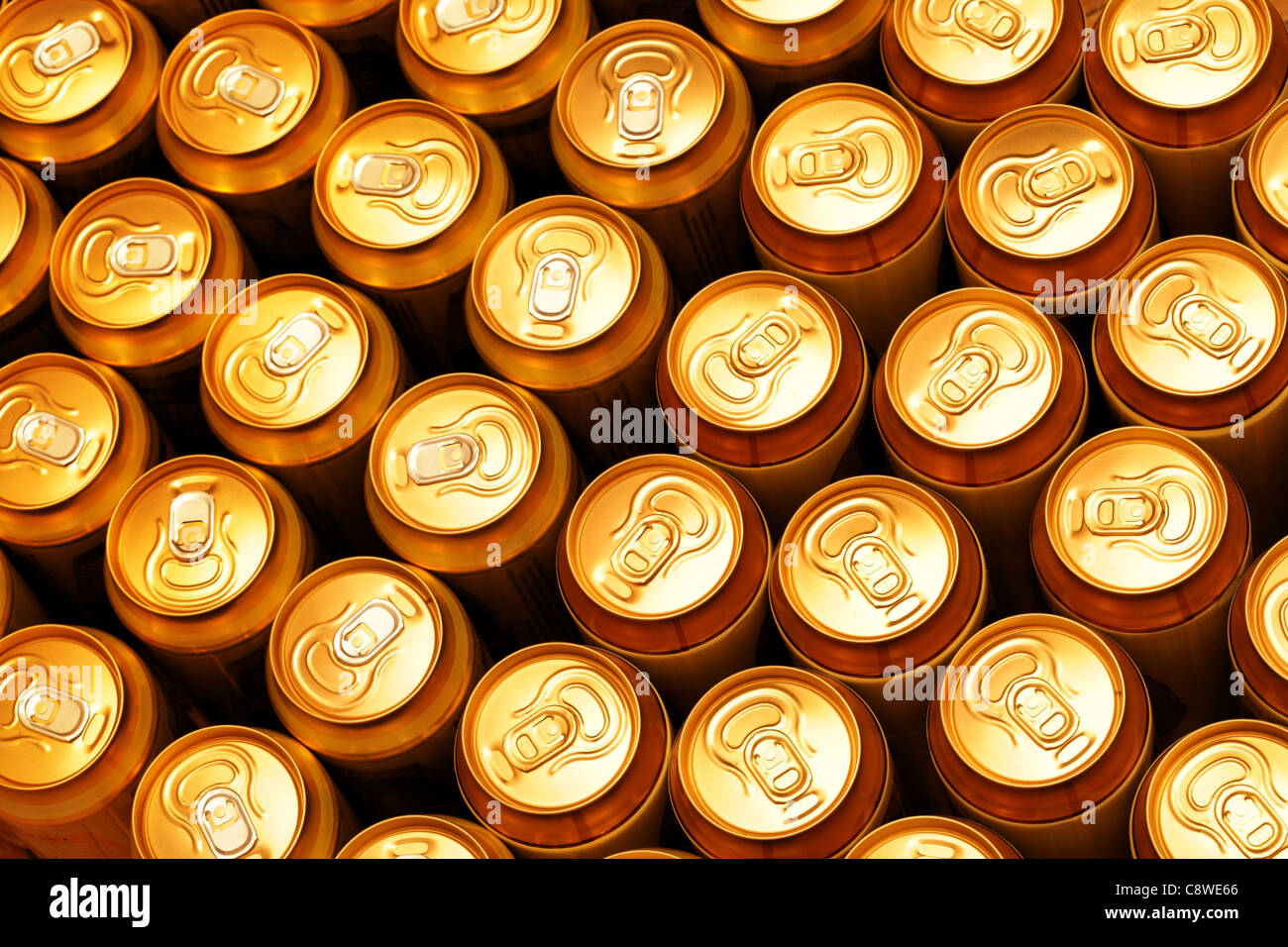 Much of gold beer cans close up Stock Photo - Alamy