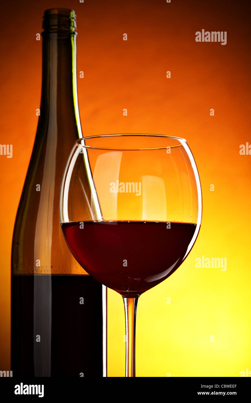 Still-life with glass and bottle of red wine Stock Photo - Alamy