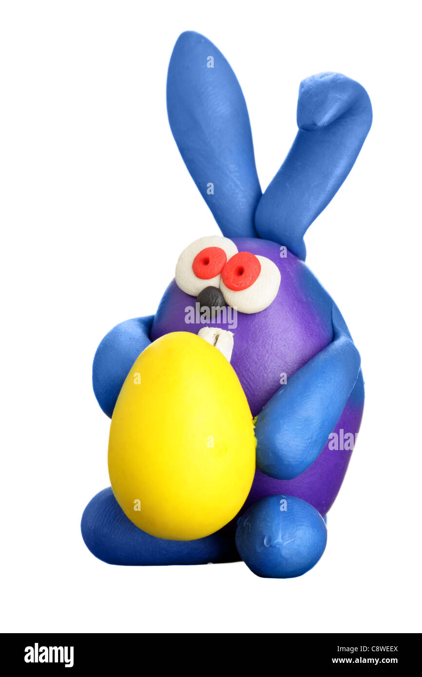 Plasticine rabbit with easter egg isolated over the white background ...