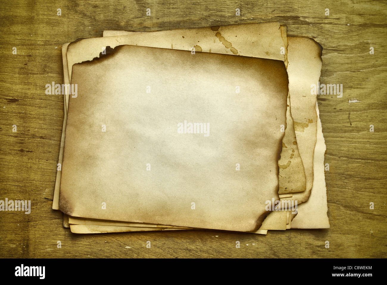 Old papers on a wooden table hi-res stock photography and images - Alamy