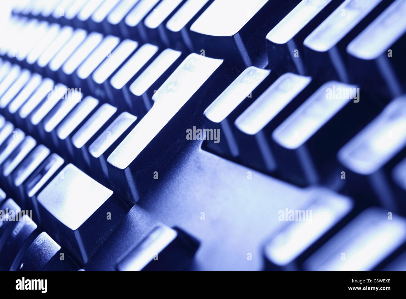 Computer keyboard close-up in blue light. Shallow DOF! Stock Photo - Alamy