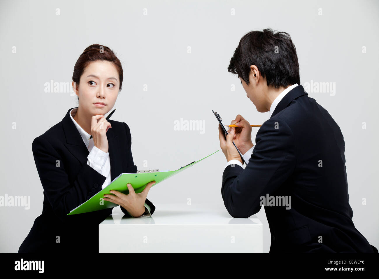 Two women facing each other serious hi-res stock photography and images ...