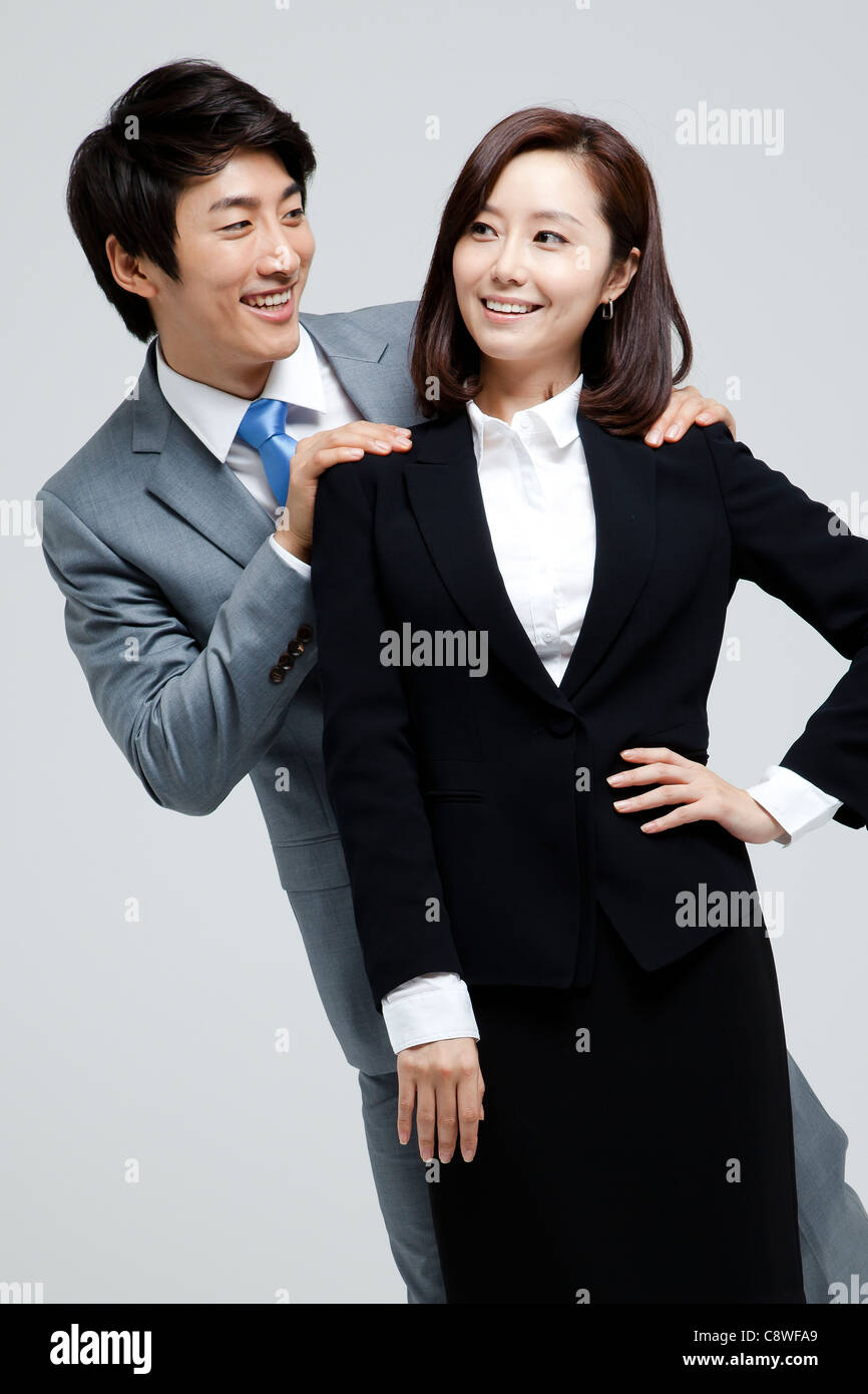 Two men standing behind each other hi-res stock photography and images ...