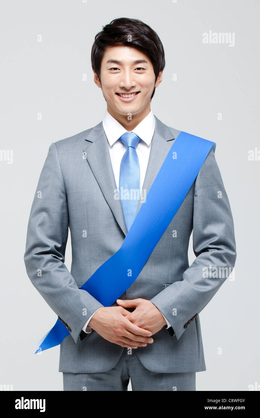 Portrait Of Asian Businessman Wearing Sash With Hand Clasped Stock ...