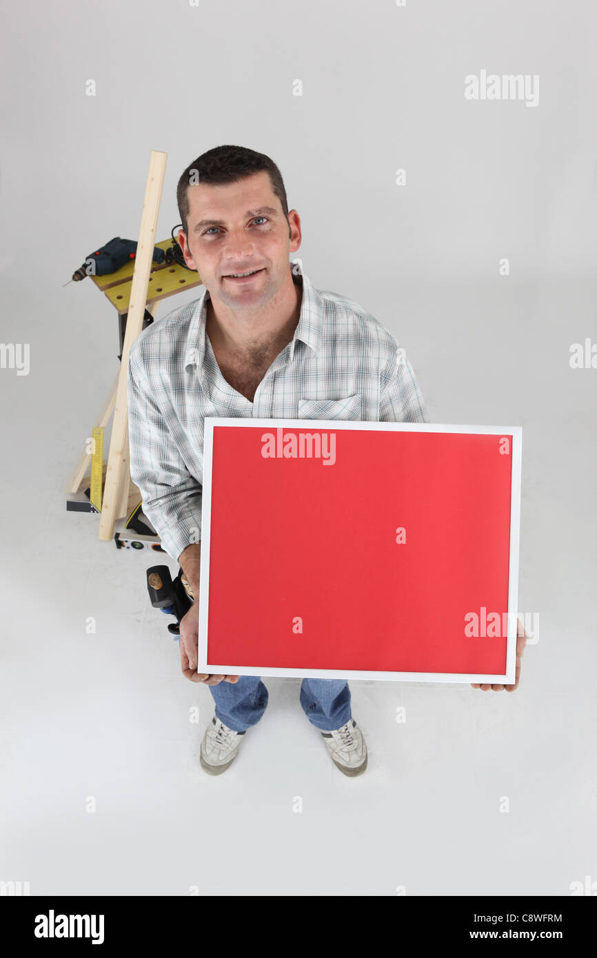 Laborer with red sign isolated on white background Stock Photo - Alamy