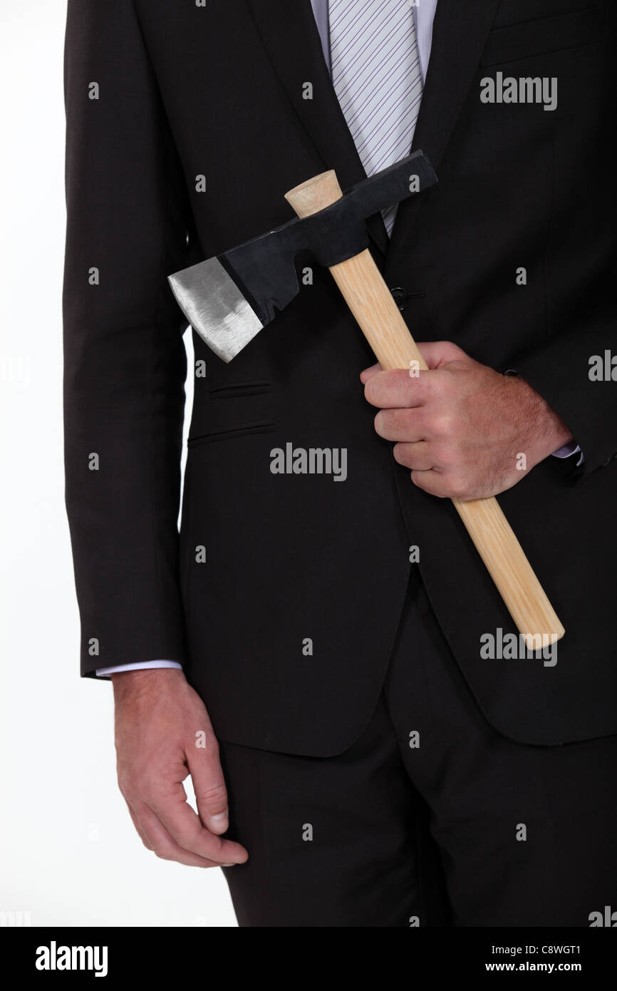 hand of man in suit holding axe Stock Photo - Alamy