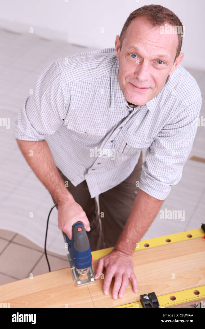 Man using a jigsaw Stock Photo - Alamy