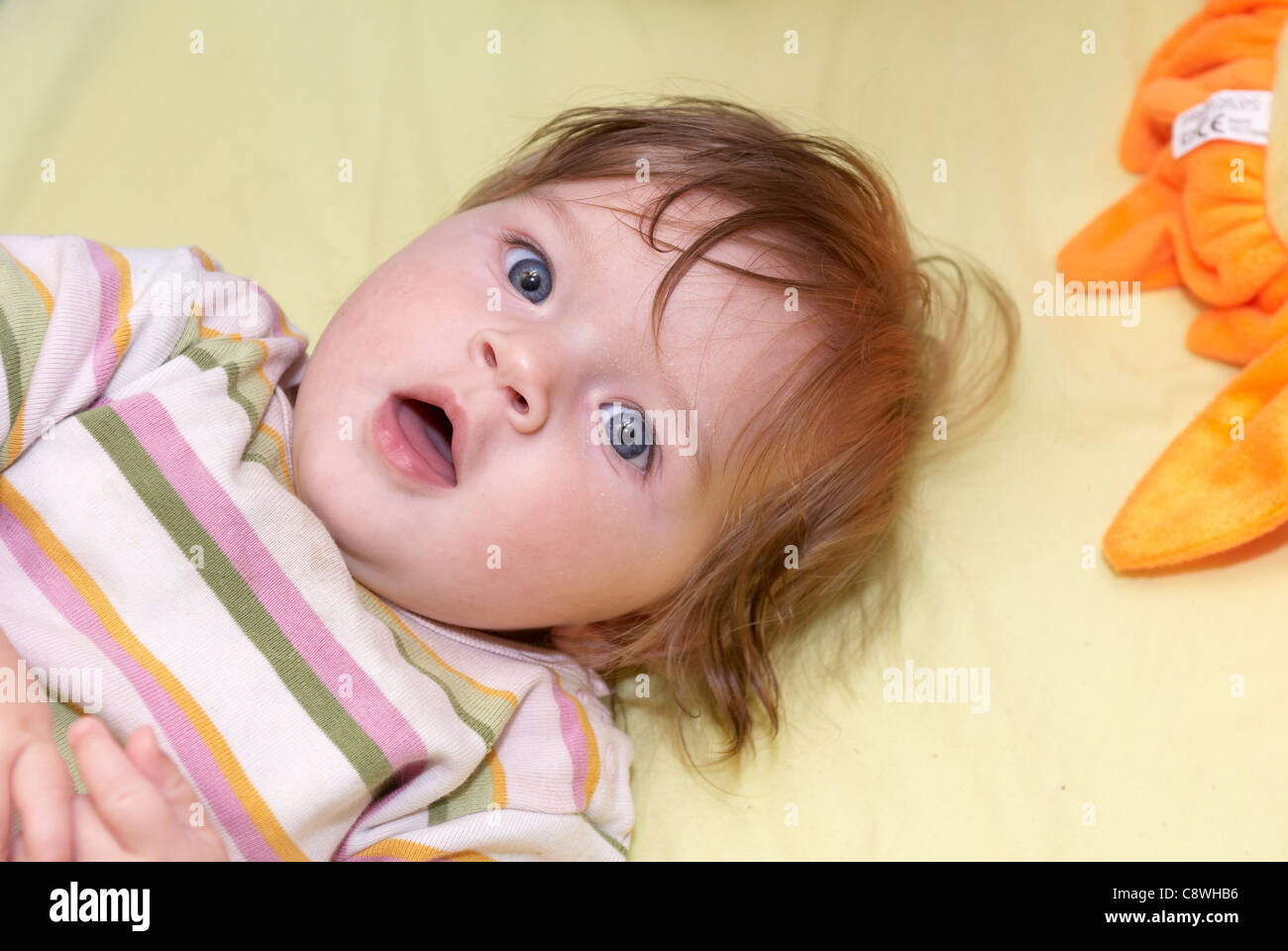 Baby child girl 6-8 months old in crib Stock Photo - Alamy