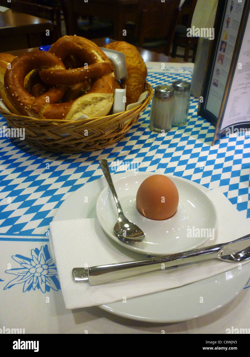 German breakfast of egg and pretzel in Munich, Germany during ...