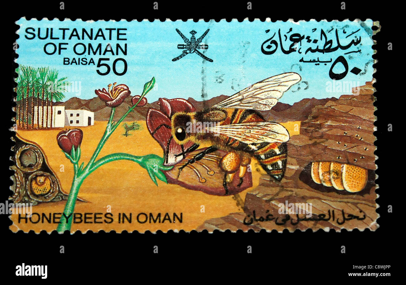 A postage stamp of Oman in black background Stock Photo - Alamy