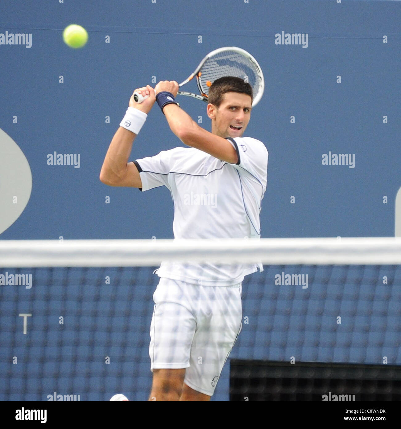 Novak djokovic swinging hi-res stock photography and images - Alamy