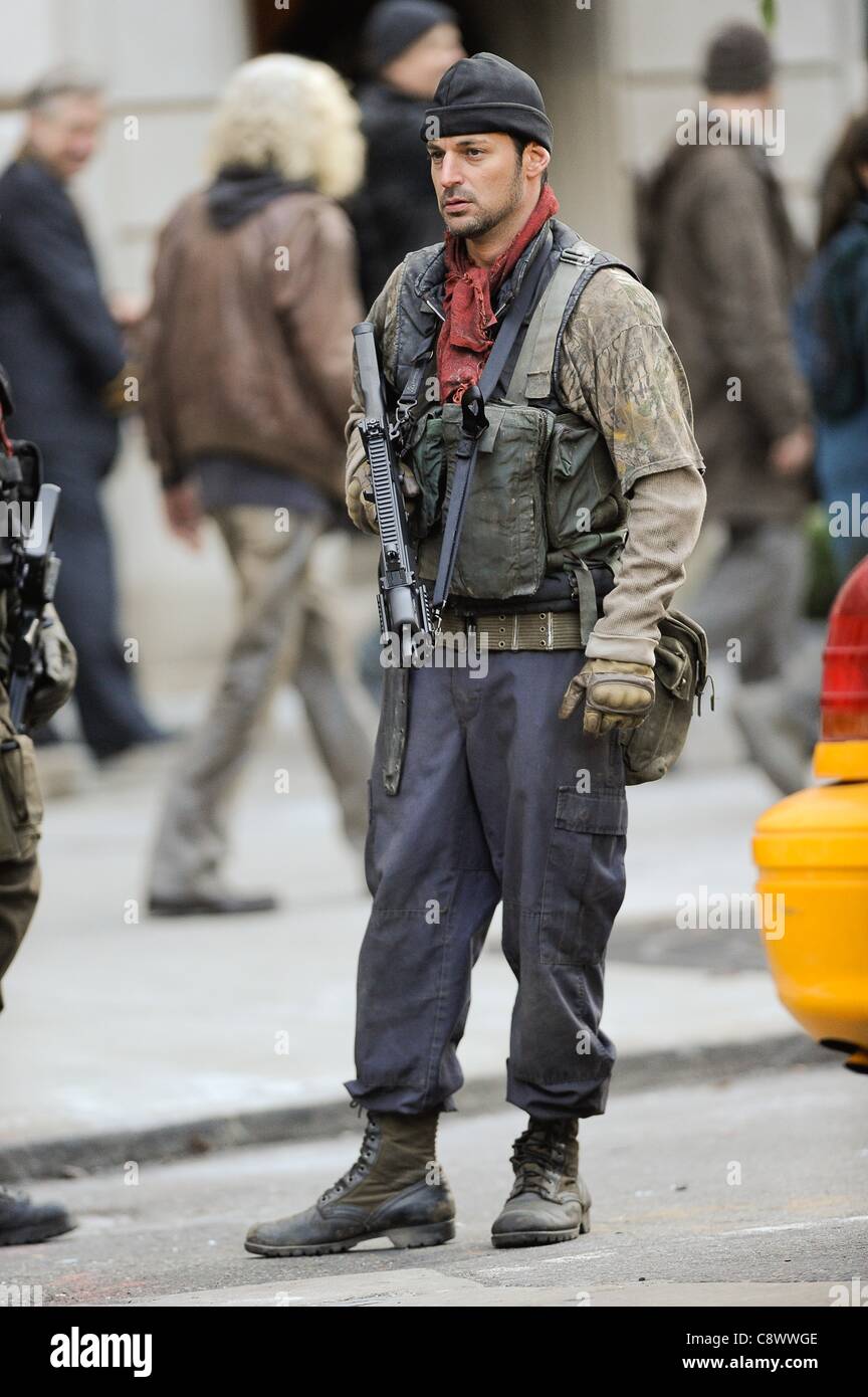 Movie extras film a riot scene at the 'Dark Knight Rises' movie set in ...