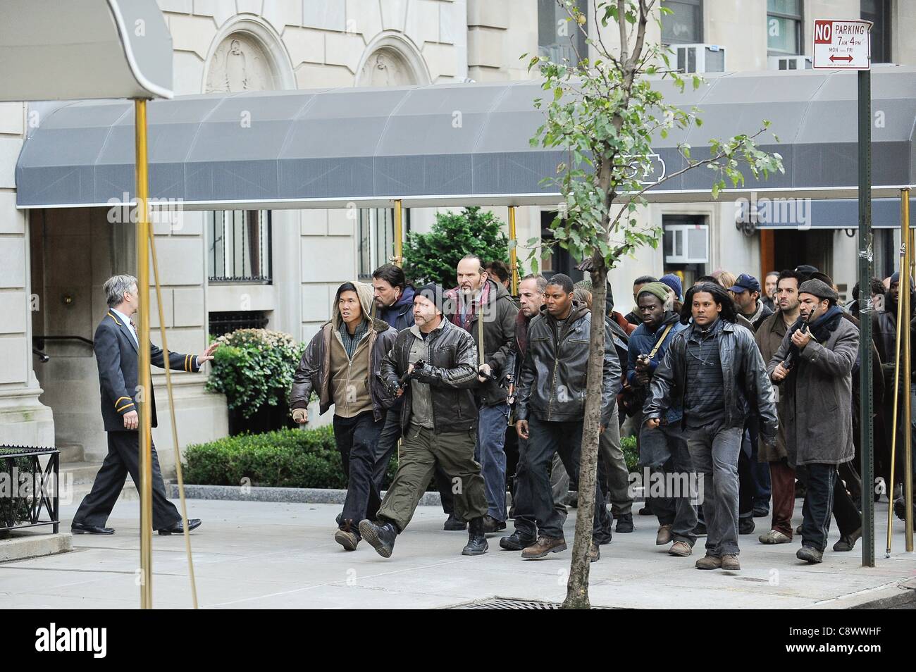 Movie extras film a riot scene at the 'Dark Knight Rises' movie set in ...