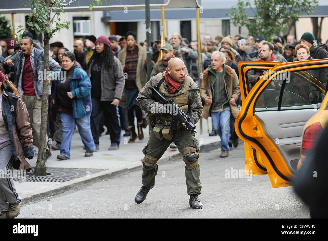 Movie extras film a riot scene at the 'Dark Knight Rises' movie set in ...