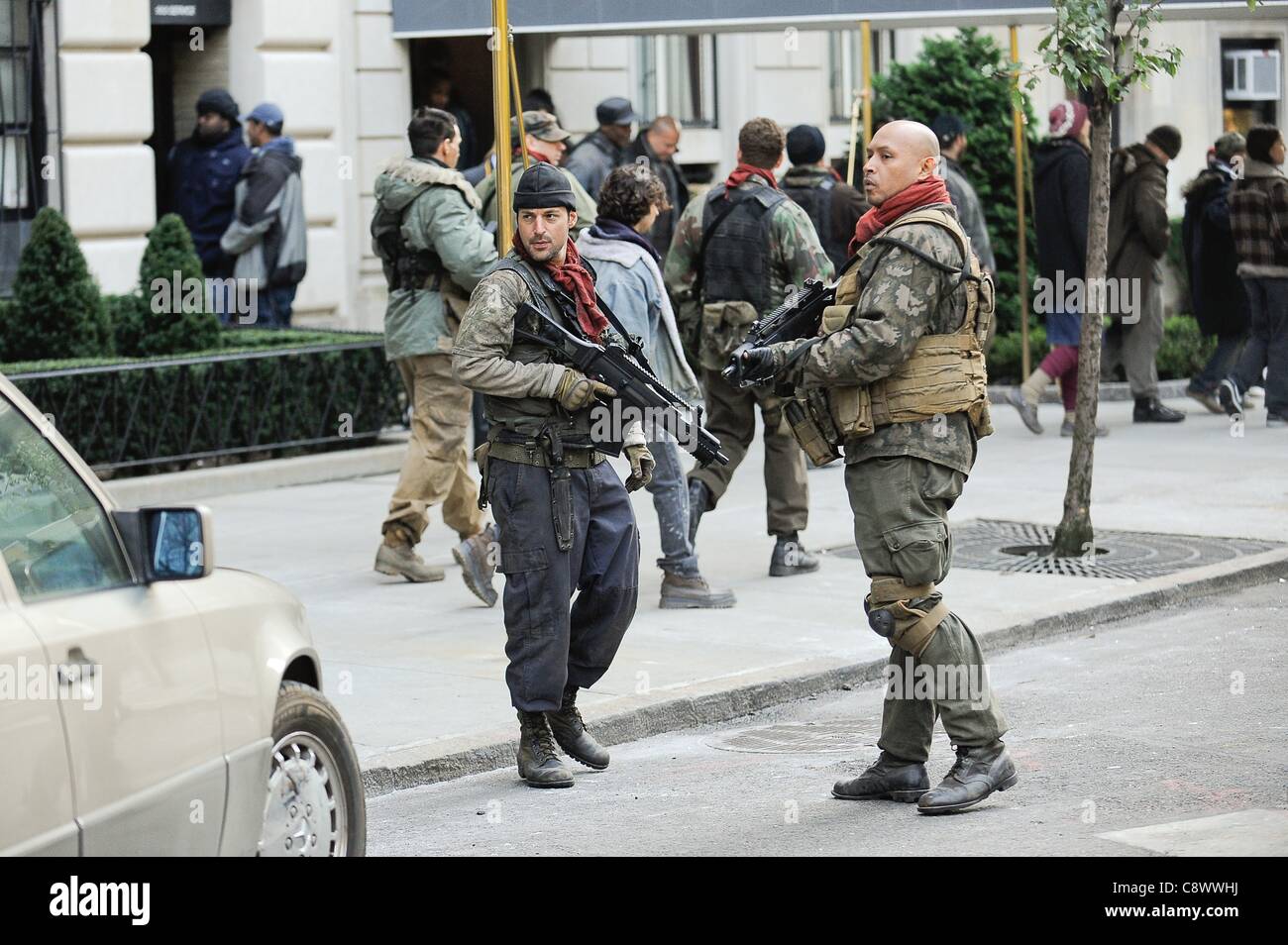 Movie extras film a riot scene at the 'Dark Knight Rises' movie set in ...
