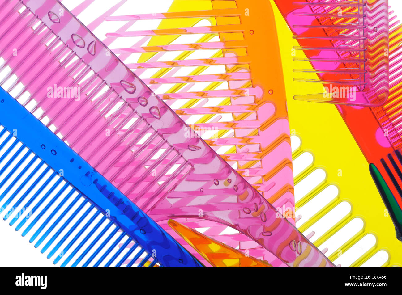Set multi-coloured transparent combs. It is photographed on a gleam. It ...