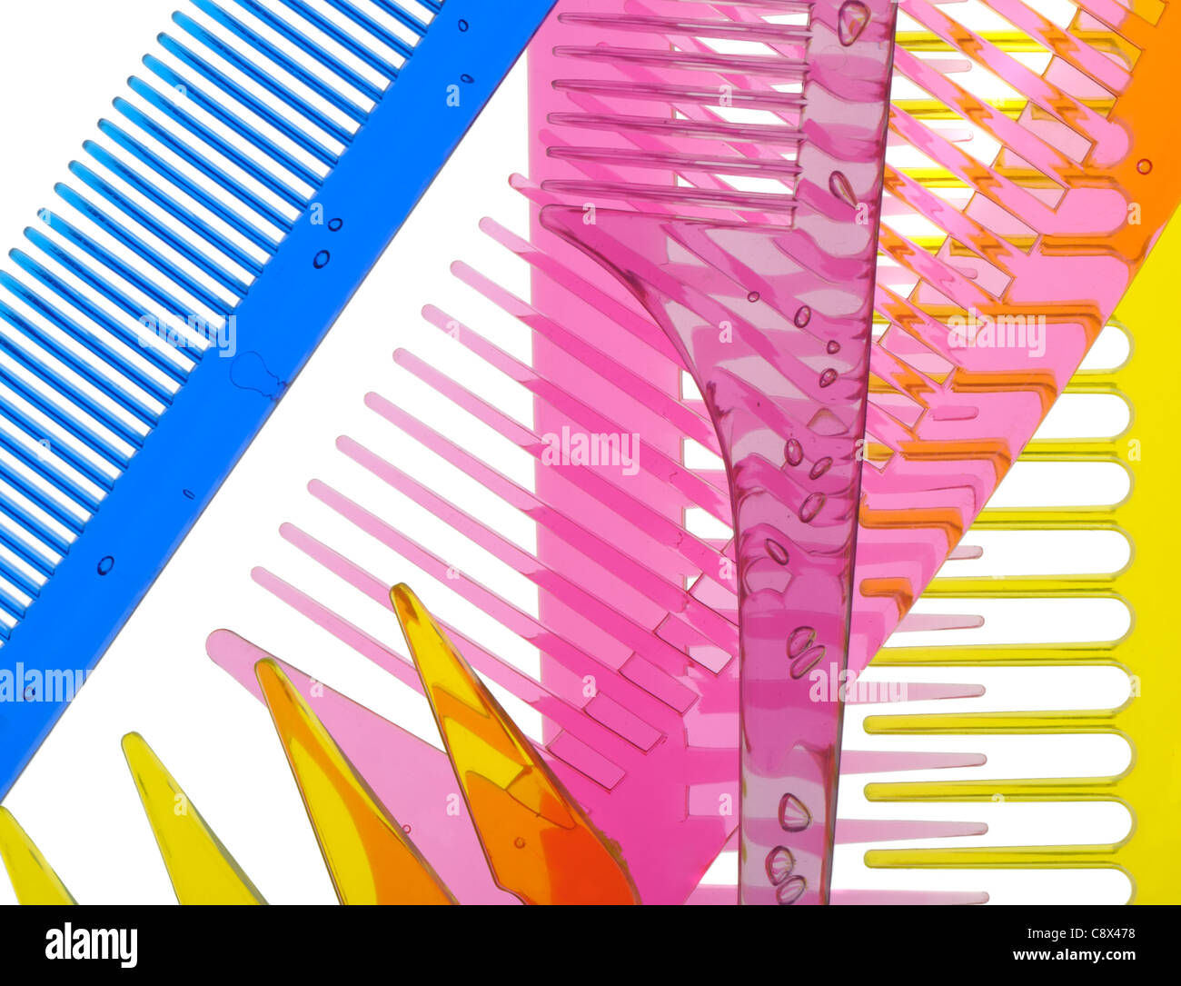 Set multi-coloured transparent combs. It is photographed on a gleam. It ...