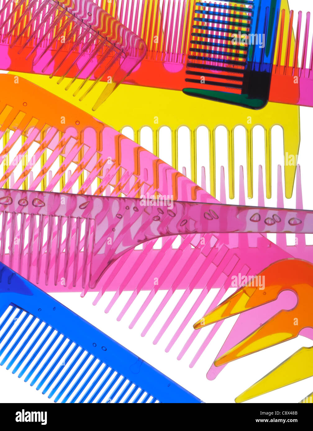 Set multi-coloured transparent combs. It is photographed on a gleam. It ...