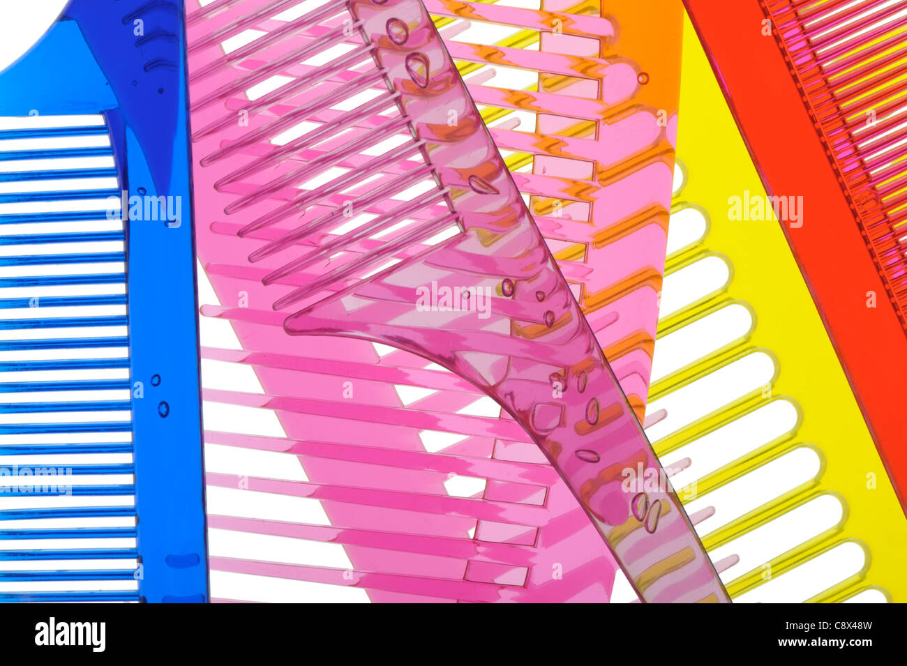 Set multi-coloured transparent combs. It is photographed on a gleam. It ...