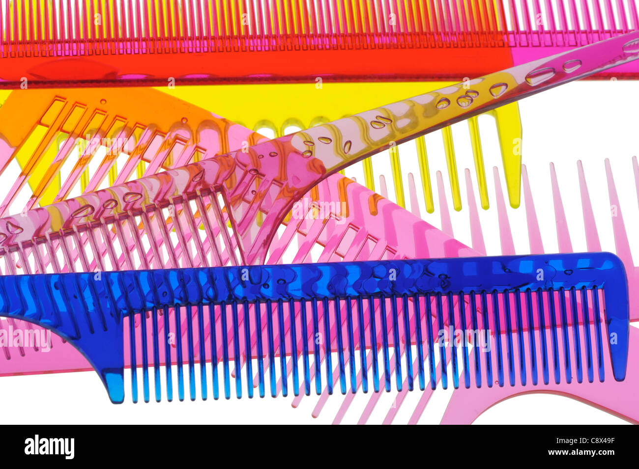 Set multi-coloured transparent combs. It is photographed on a gleam. It ...