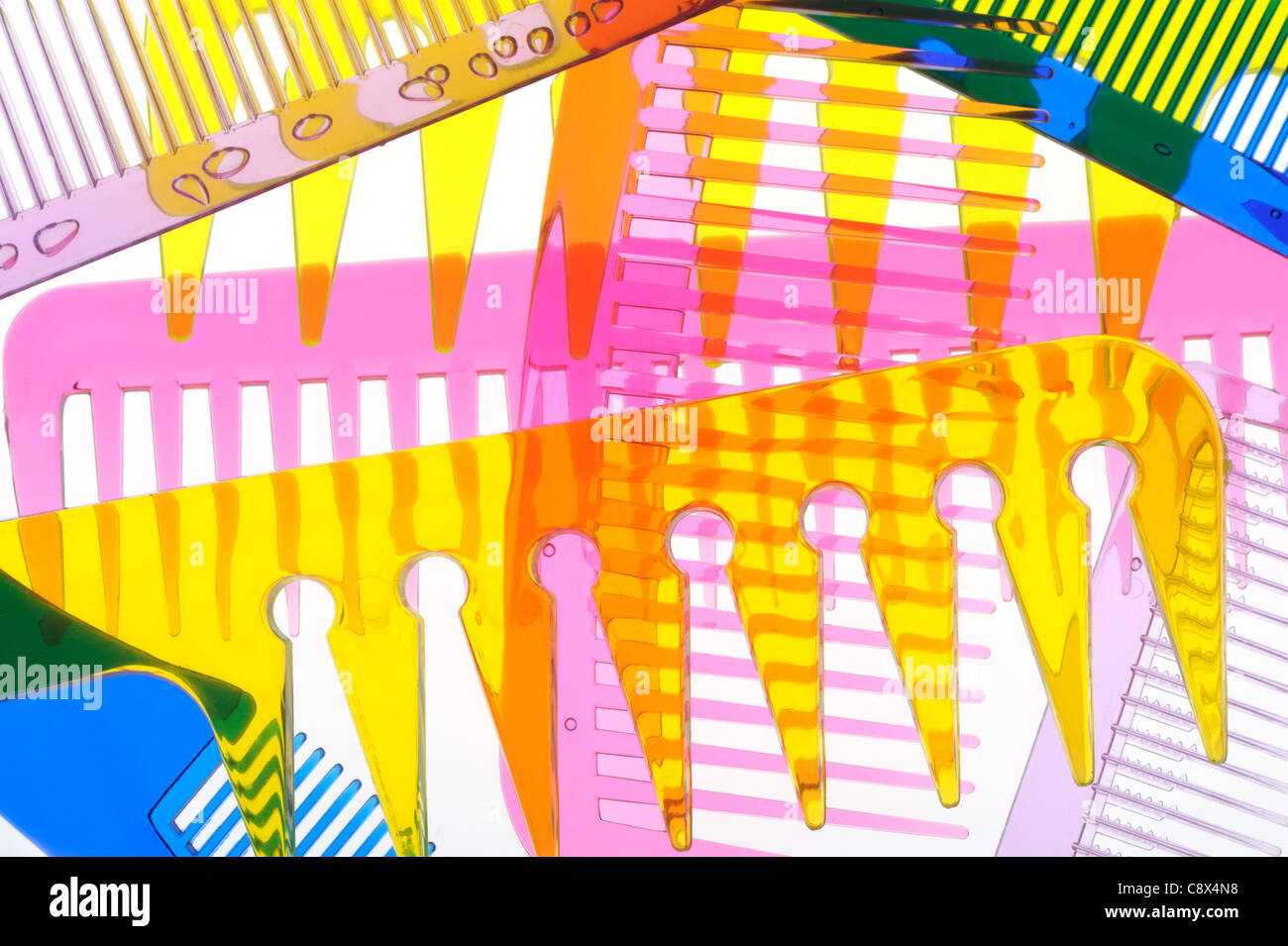 Set multi-coloured transparent combs. It is photographed on a gleam. It ...
