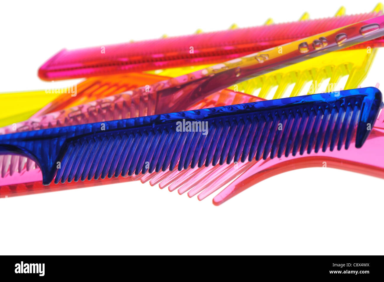 Set multi-coloured transparent combs. It is photographed on a gleam. It ...