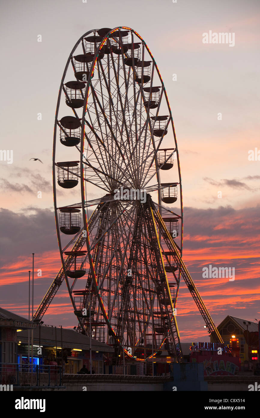A ferris wheel on the South Pier at Blackpool at sunset Stock Photo - Alamy