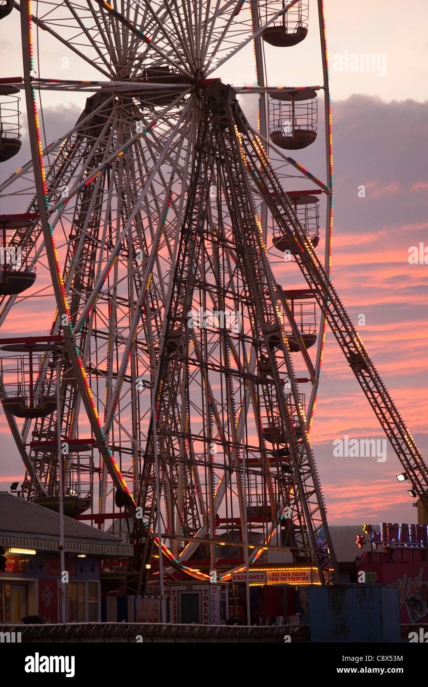 A ferris wheel on the South Pier at Blackpool at sunset Stock Photo - Alamy