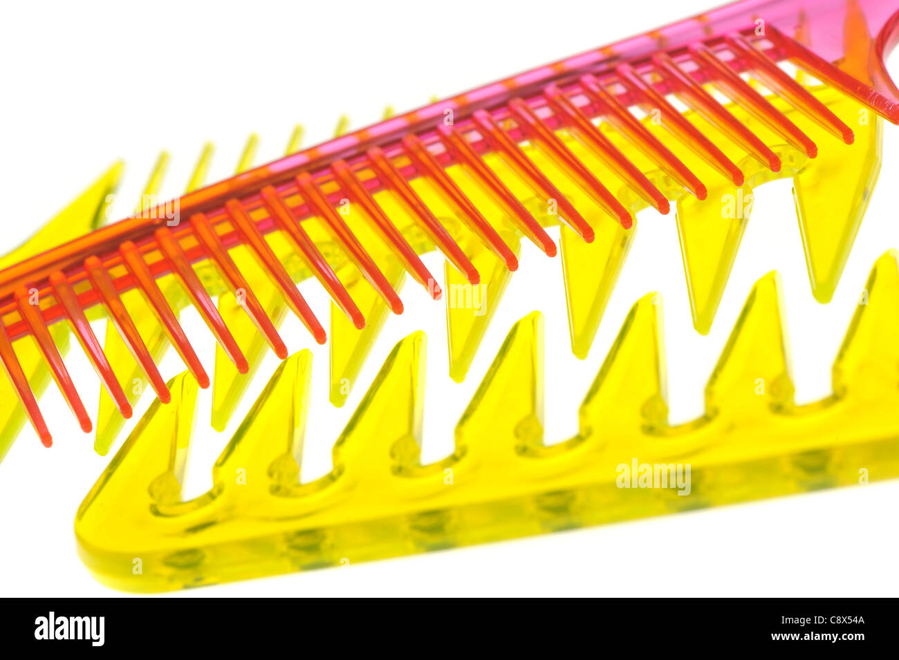 Set multi-coloured transparent combs. It is photographed on a gleam. It ...
